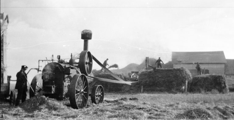 Historic photo shows the pioneer days of threshing from the stack